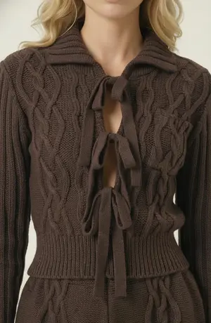 MODENAIRE Ribbed Knit Romper With Bow Tie Front And Long Sleeves