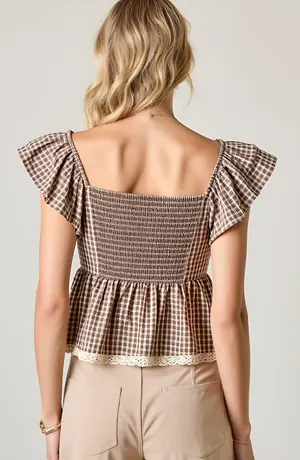 MODENAIRE Peplum Top With Flutter Sleeves And Front Tie