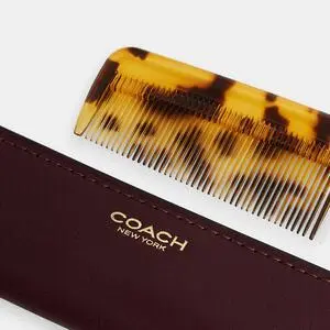 COACH Comb With Leather Sleeve