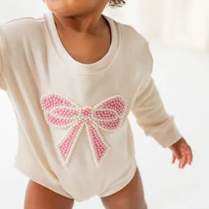 SWEET WINK Pearl Bow Patch Long Sleeve Romper