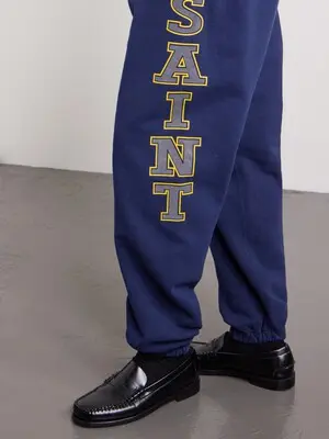 SAINT MXXXXXX Saint College Logo-print Cotton-jersey Sweatpants