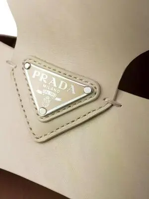 Prada Enameled Triangle Leather Slides