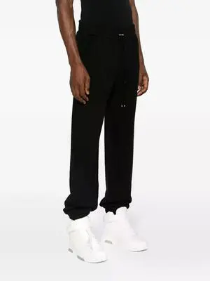 Amiri Staggered Logo-embroidered Track Pants - Black