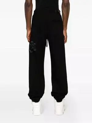Amiri Staggered Logo-embroidered Track Pants - Black
