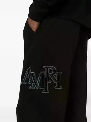 Amiri Staggered Logo-embroidered Track Pants - Black