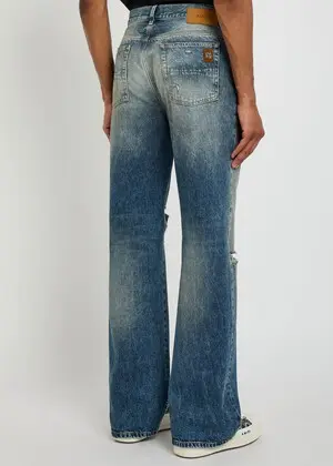 Amiri Slashed Distressed Bootcut Jeans