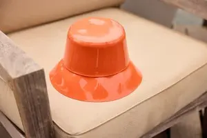 LASTELIER Smile Vinyl Bucket Hat