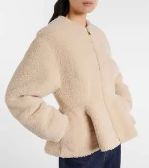 Alaïa Peplum Shearling Jacket - Beige