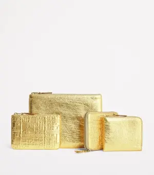 Comme Des Garçons Leather Embossed Logo Zipped Wallet