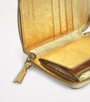 Comme Des Garçons Leather Embossed Logo Zipped Wallet