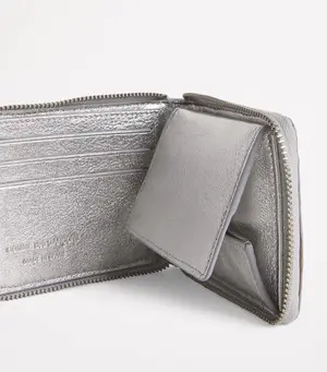Comme Des Garçons Leather Embossed Logo Zipped Wallet