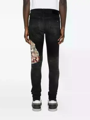 Amiri Ripped Graphic Jeans