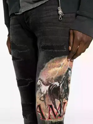 Amiri Ripped Graphic Jeans