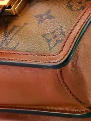 LOUIS VUITTON Dauphine Reverse Monogram Canvas Mini Crossbody Bag - Brown