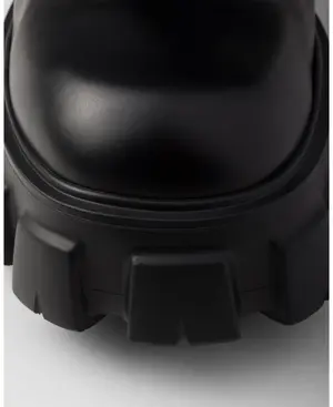 Prada Monolith Brushed Leather And Re-nylon Combat Boots With Pouch