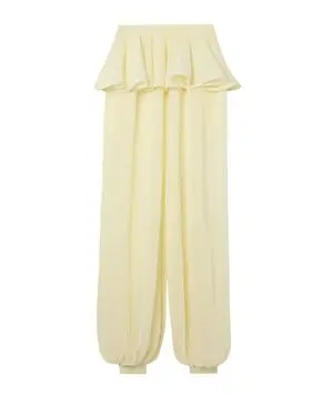Alaïa Pleated Georgette Peplum Tapered Pants - Yellow