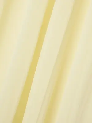 Alaïa Pleated Georgette Peplum Tapered Pants - Yellow