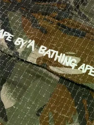 AAPE BY *A BATHING APE® Camouflage Print Trousers