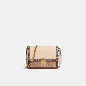 COACH Hutton Shoulder Bag In Signature Canvas With Snakeskin Detail - Brass/tan Ivory