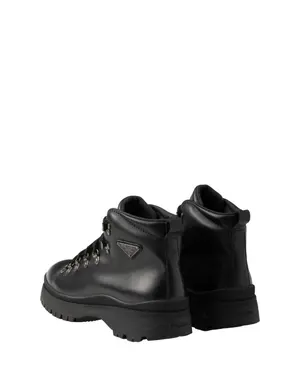 Prada Brixxen Leather Booties - Black