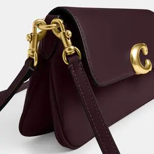 COACH® Jet Shoulder Bag - Brass/black Currant