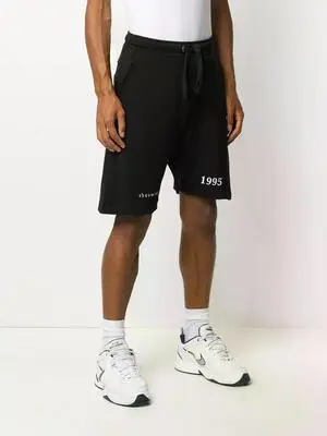 THROWBACK. Logo Embroidered Track Shorts