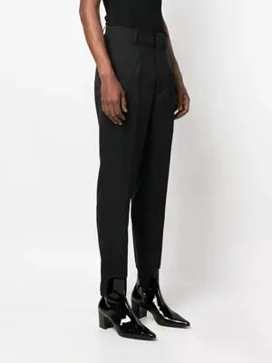 Random Identities Tapered Stirrup Trousers