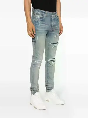 Amiri Distressed Skinny Jeans In Light
