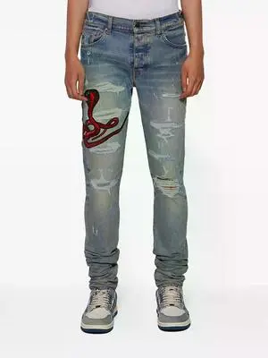 Amiri Appliqué Distressed Skinny Jeans