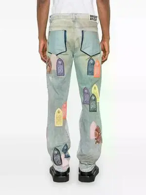 WHO DECIDES WAR Patch Arched Distressed Jeans