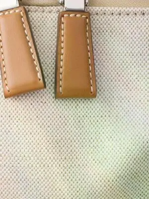 Prada Logo Embossed Duffle Bag - Neutrals
