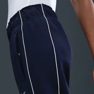 Nike Sportswear Windrunner Mid-rise Slim Knit Pants