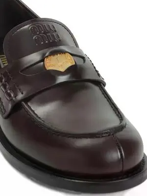 Miu Miu Brushed Leather Penny Loafers With Metal Ornament - Brown