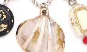PETIT MOMENTS Crest Charm Necklace