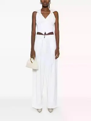 VESTIAIRE D'UN OISEAU LIBRE Pleated-front Trousers