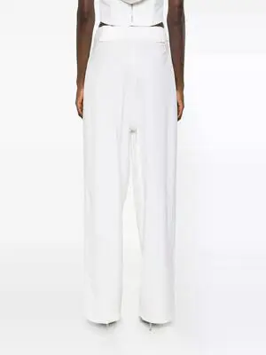 VESTIAIRE D'UN OISEAU LIBRE Pleated-front Trousers