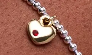 Estée Lauder Heart Padlock Slide Bracelet