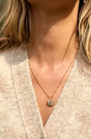 Estée Lauder Sunburst Pendant Necklace