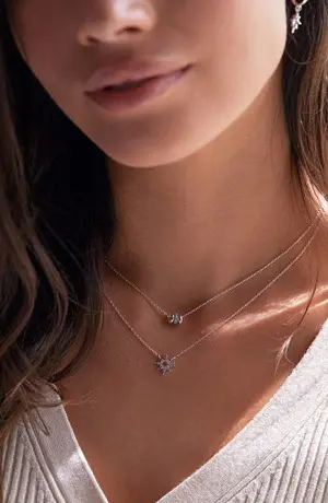 Estée Lauder Triple Ring Pendant Necklace