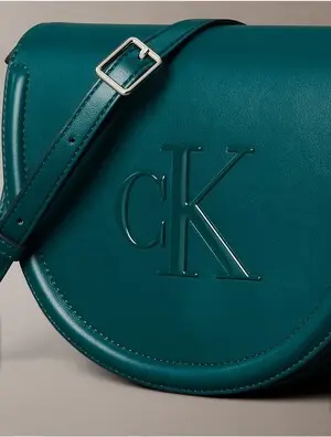 Calvin Klein Embossed Monogram Saddle Bag - Maya Blue