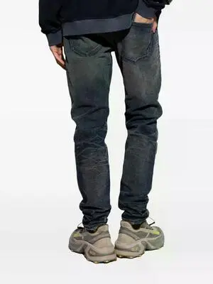 DIESEL® Faded Distressed Jeans