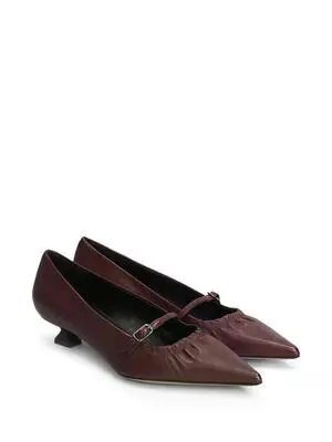 THE SELLER Pointed-toe Buckle Pumps