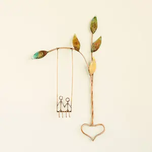 UNCOMMON GOODS Rooted In Love Swing Sculpture Haw Creek Forge - Loving Couple