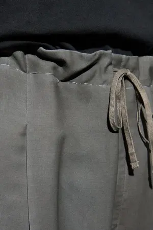 MAISON MARGIELA Creased Trousers With Vintage Effect