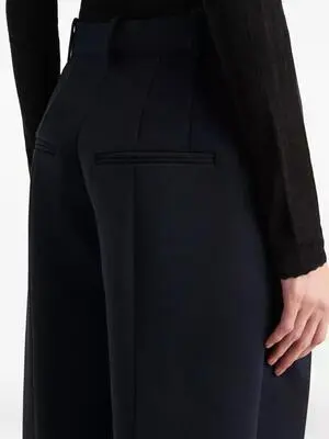 Khaite Button-detailed Pleated Trousers