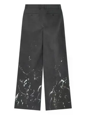 We11Done Pleated Paint-splatter Trousers
