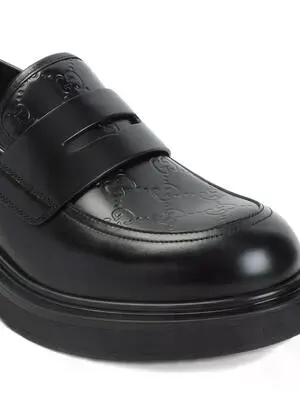Gucci Monogram Debossed Loafers