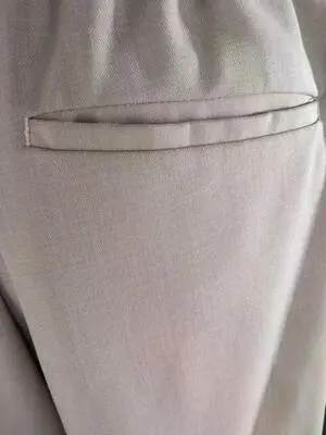 MYTHS Pleated Tapered Trousers