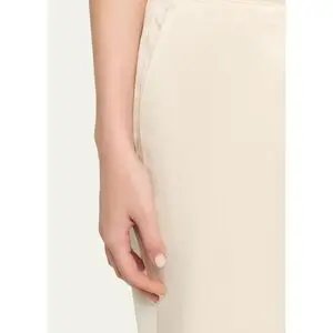 TOTEME Kick Flare Raw-edge Trousers