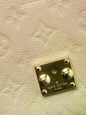 LOUIS VUITTON Pochette Métis Monogram Empreinte Handbag